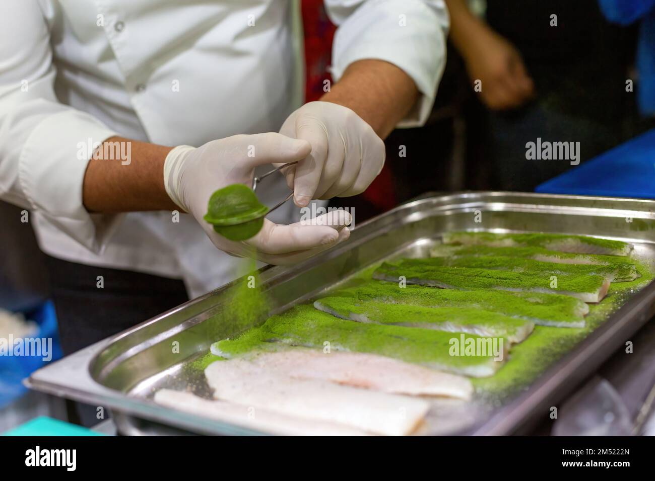 The chef cooking sole. Marinating fish with a mixture of 5 spices ...