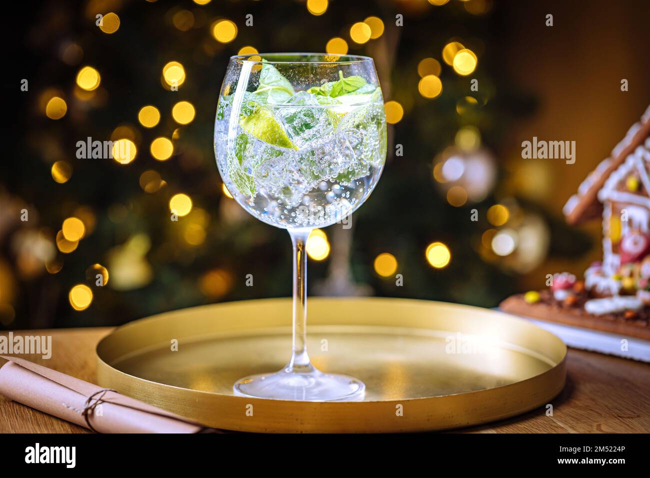 Gin and tonic with christmas tree background hi-res stock photography ...