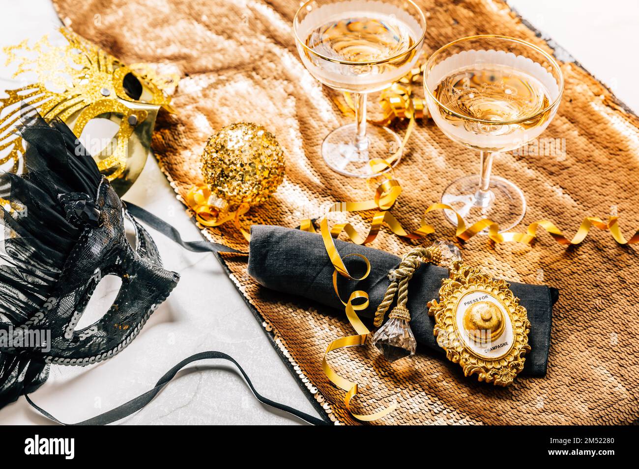 Two glasses of sparkling wine on festive table for New Year, party or ...