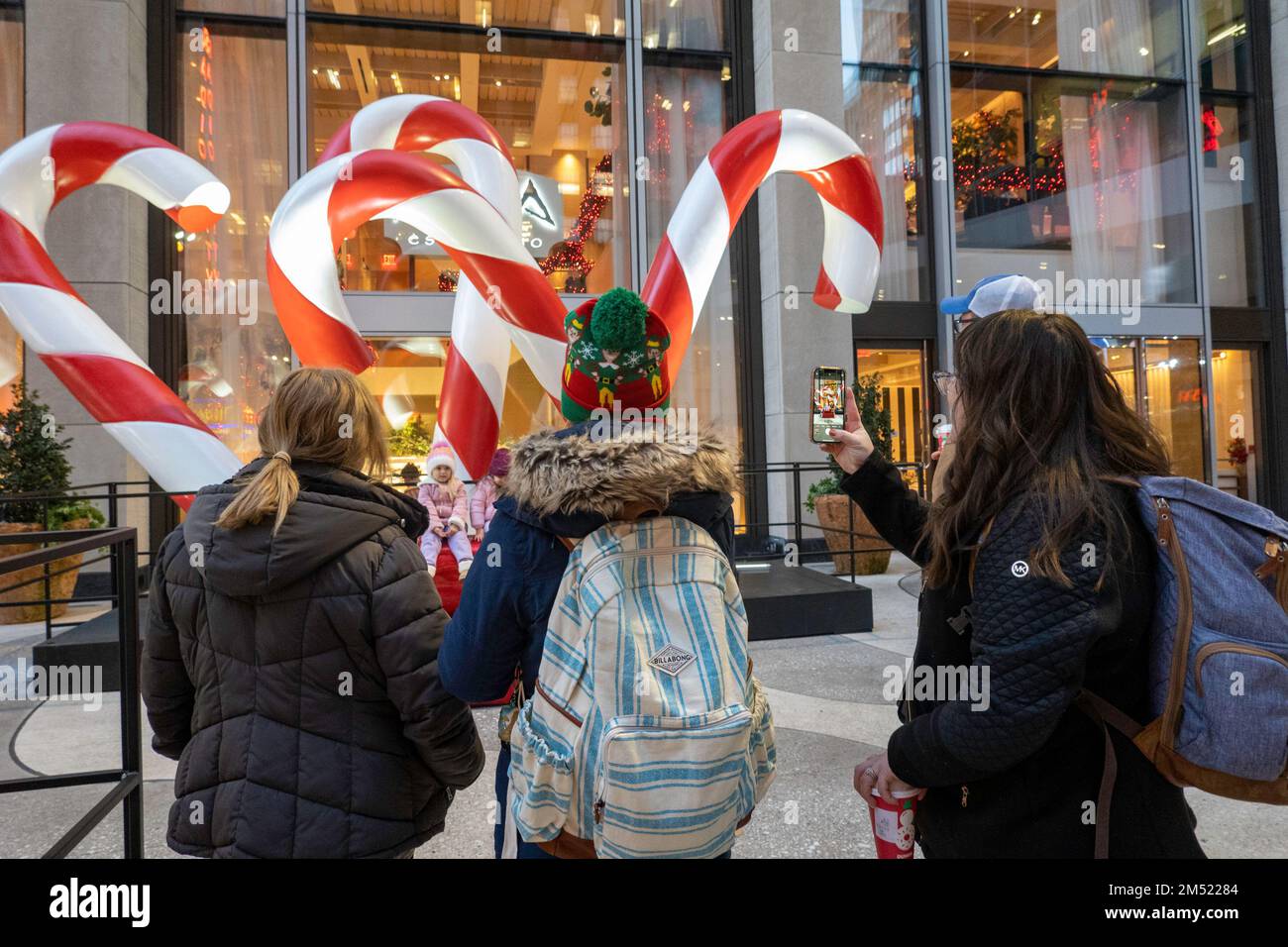 Giant candy canes deck the plaza in front of Avra Estiatorio restaurant ...