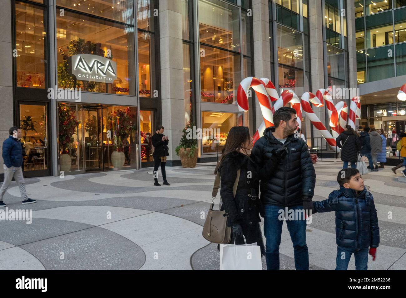 Giant candy canes deck the plaza in front of Avra Estiatorio restaurant ...