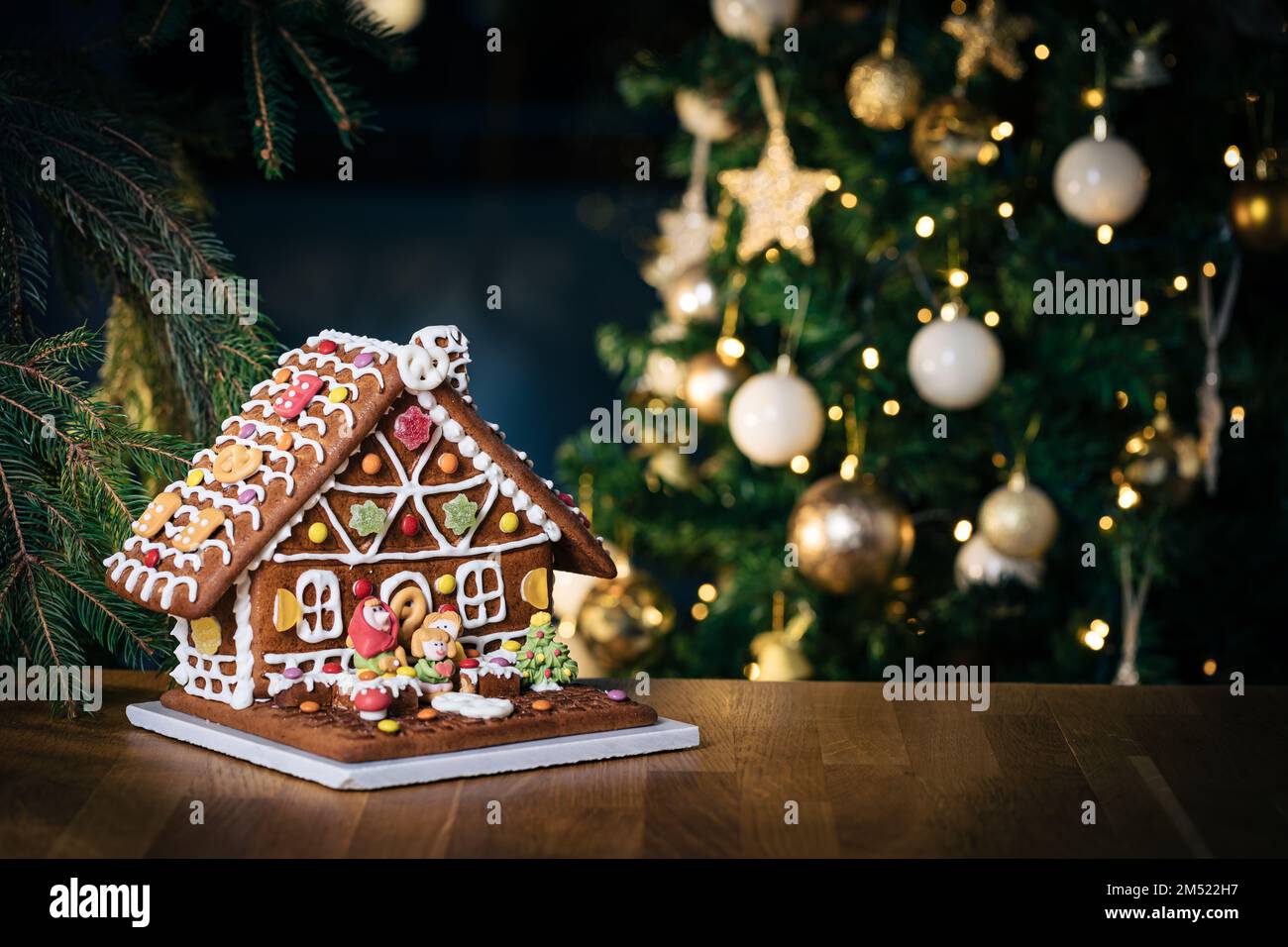 Christmas house made from gingerbread. Playfully decorated with ...