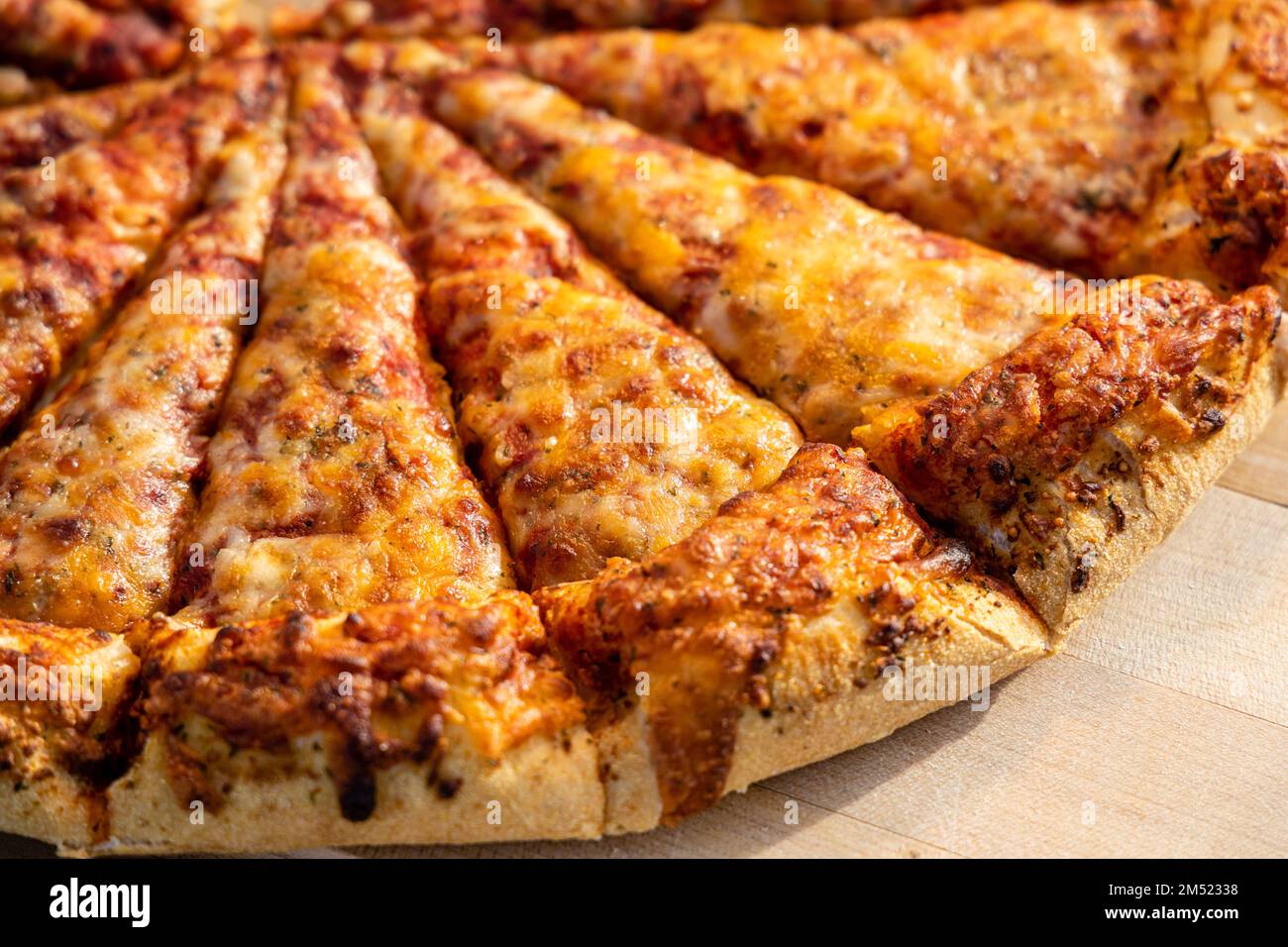 A Stock Image of a large sliced pizza served in an outdoor setting ...