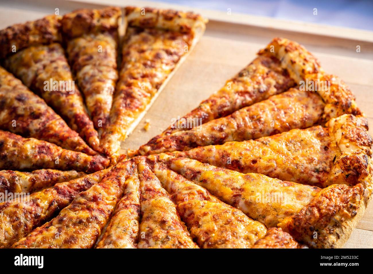 A Stock Image of a large sliced pizza served in an outdoor setting ...