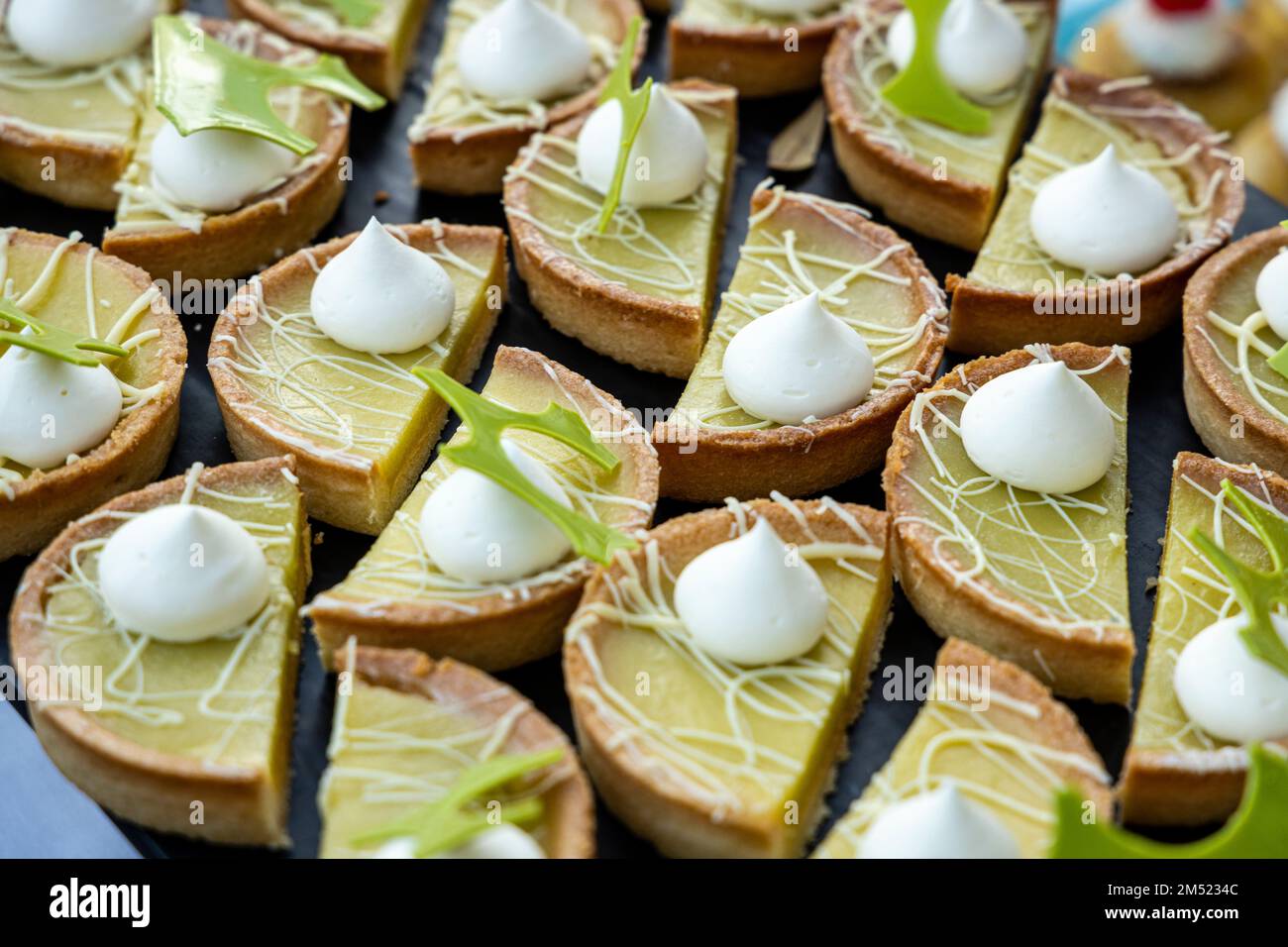 Stock image of large tray of fancy tarts served in an outdoor buffet ...