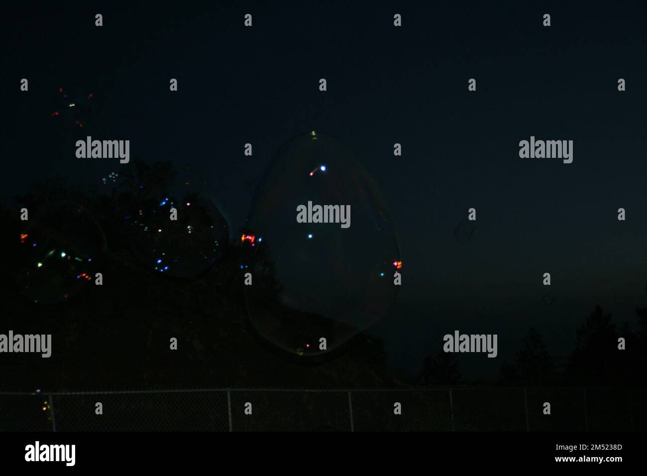 Nighttime Giant Bubbles Stock Photo - Alamy