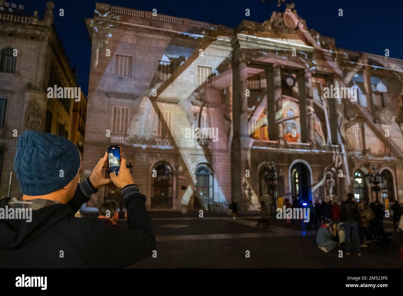 A person is seen taking pics of the scene of the Nativity scenes ...