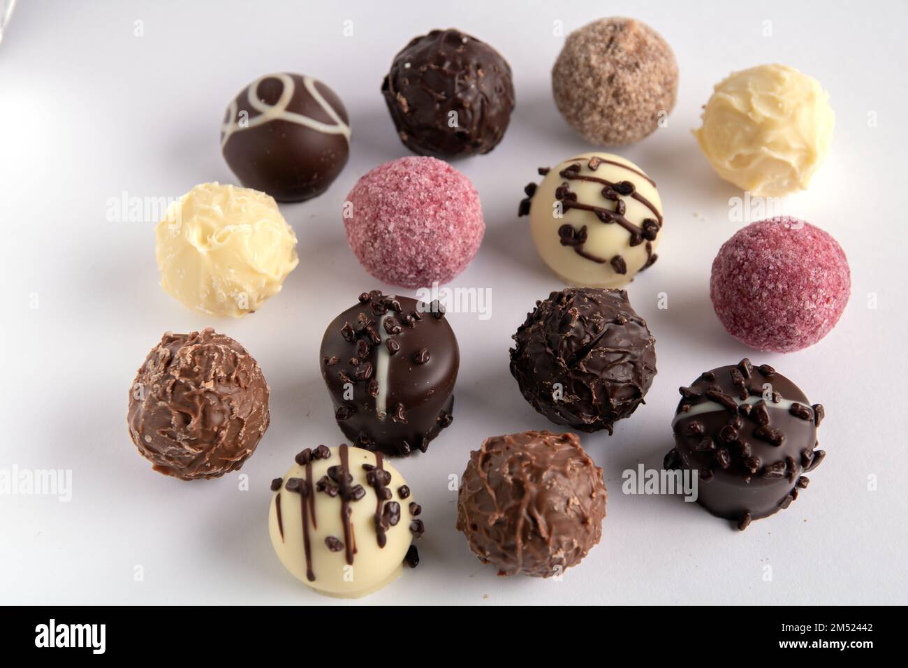 A photo of many different chocolates on a white background Stock Photo ...