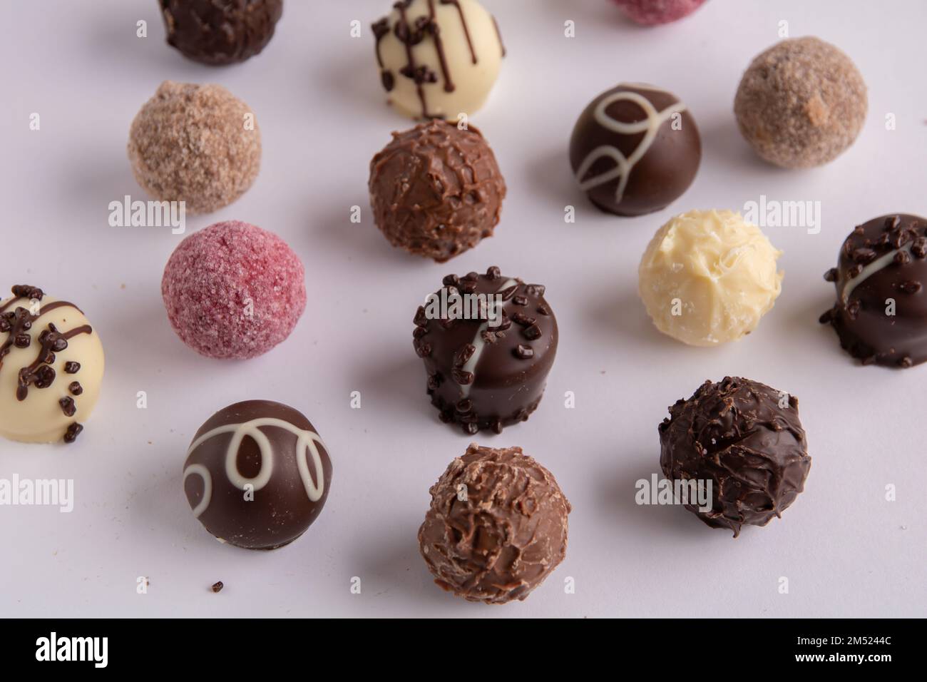 photo of differently shaped candies on a white background Stock Photo ...