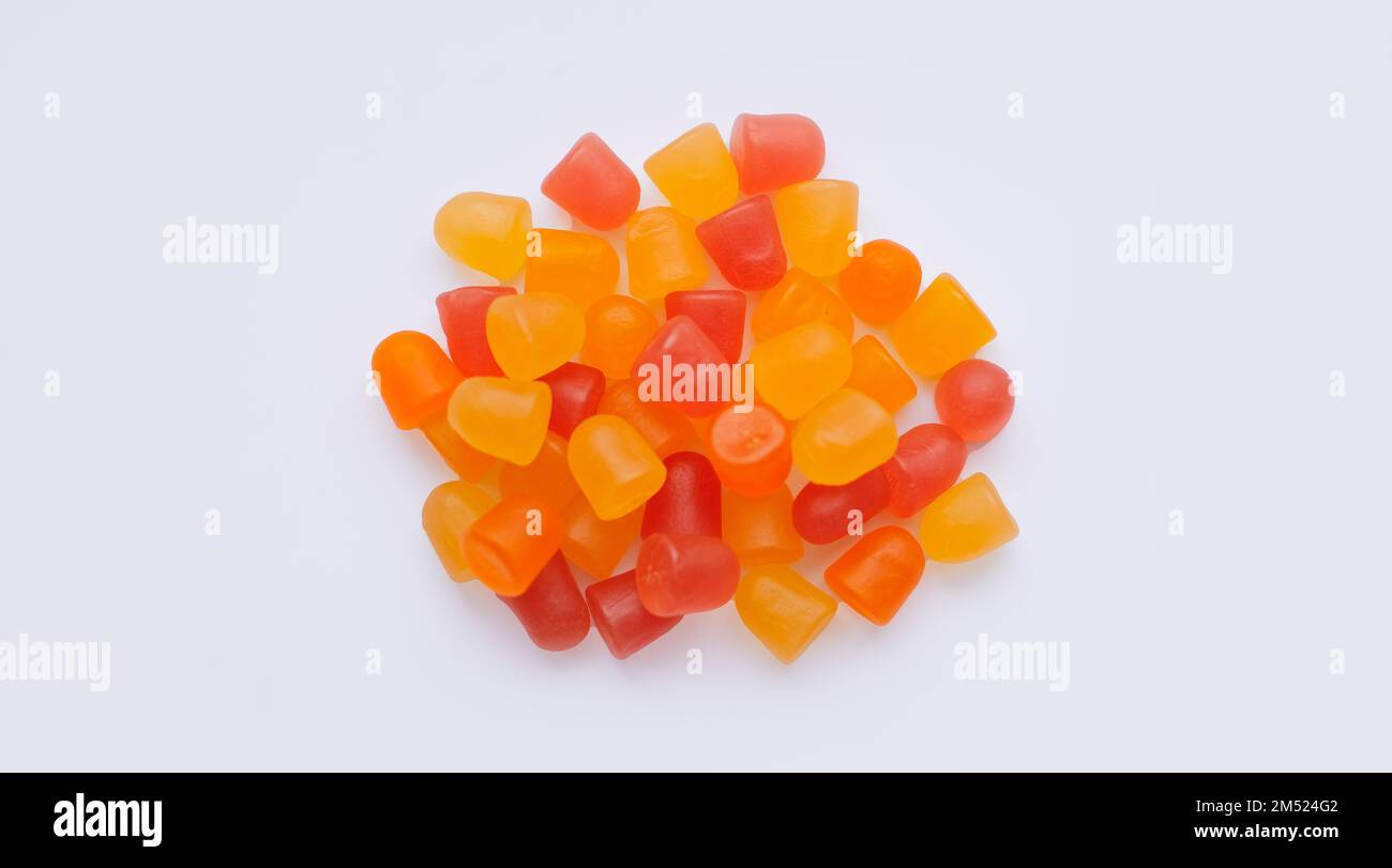 Selective focus, close-up texture of orange and yellow multivitamin ...