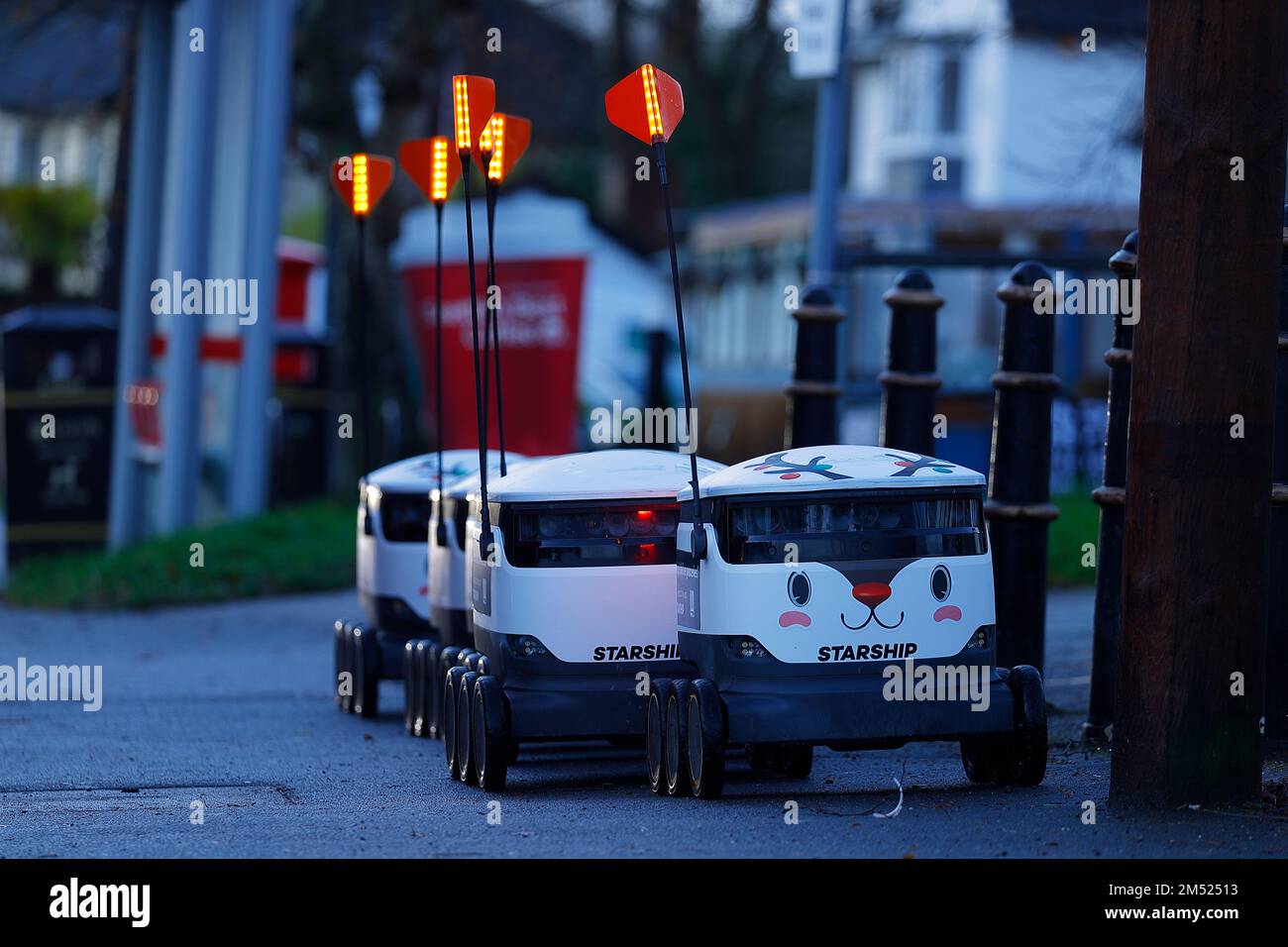 A line of autonomous robots await instructions before carrying out ...