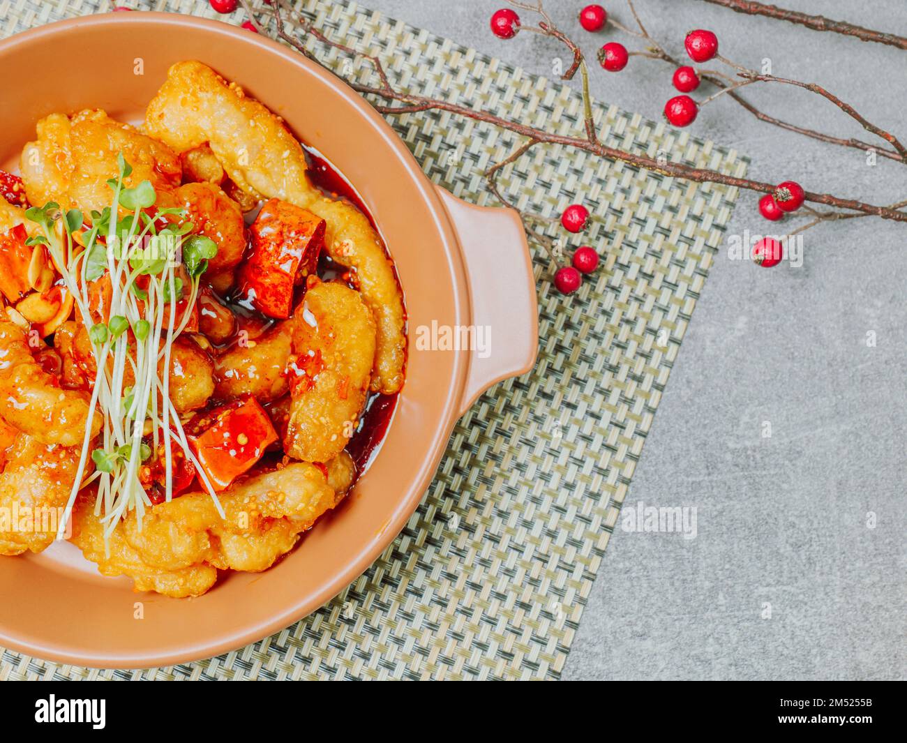 Spicy sweet and sour pork dish served on a plate Stock Photo - Alamy