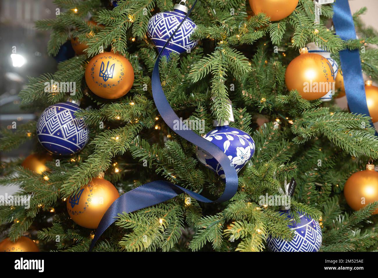 The Christmas tree on Sofiyivska Square in Kyiv is decorated with blue ...