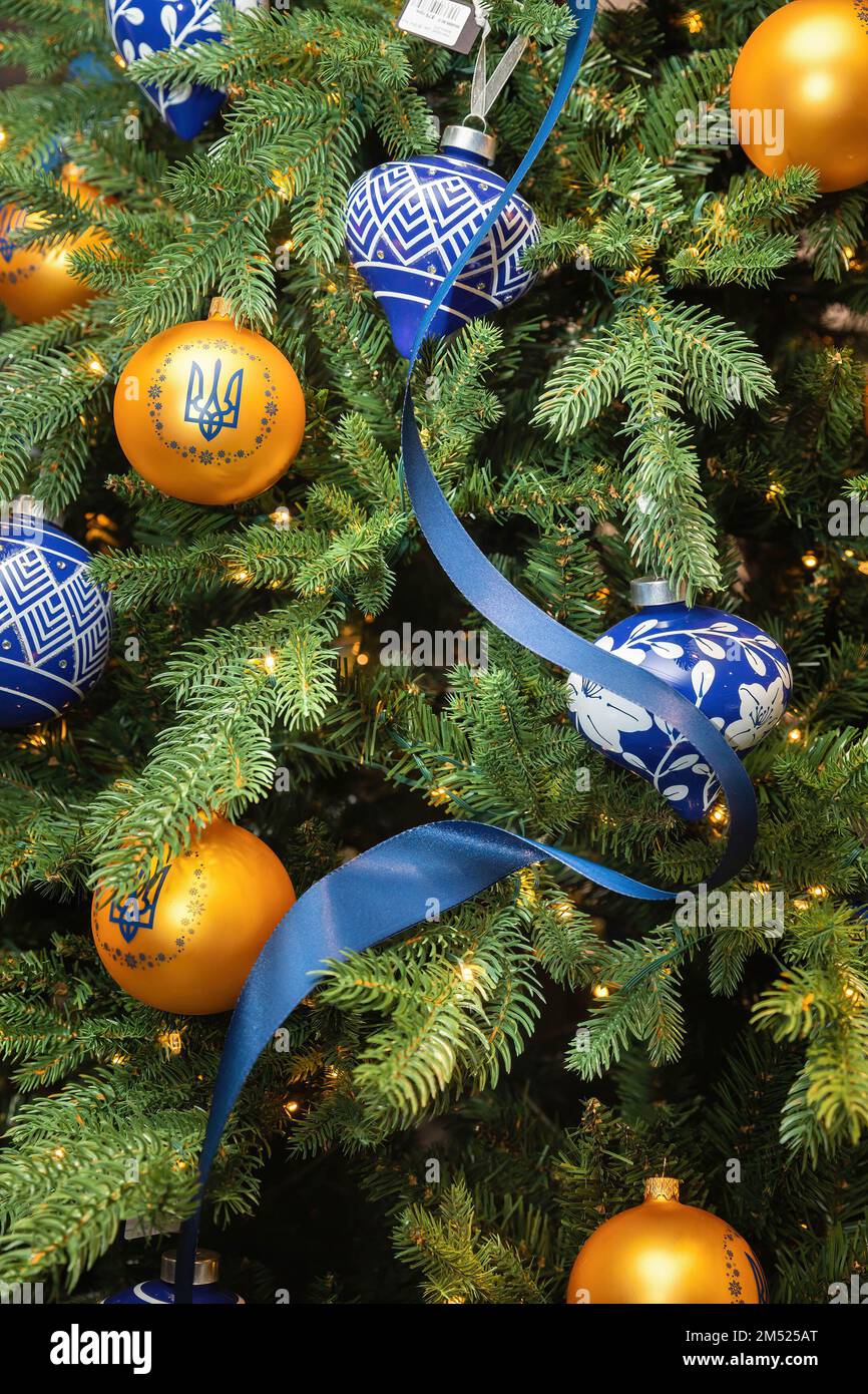 The Christmas tree on Sofiyivska Square in Kyiv is decorated with blue ...