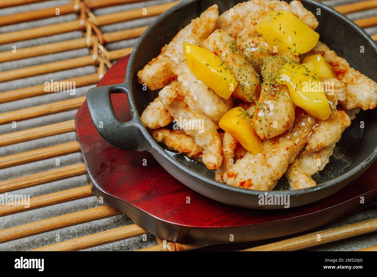Chinese food sweet and sour pork dish in black bowl Stock Photo - Alamy