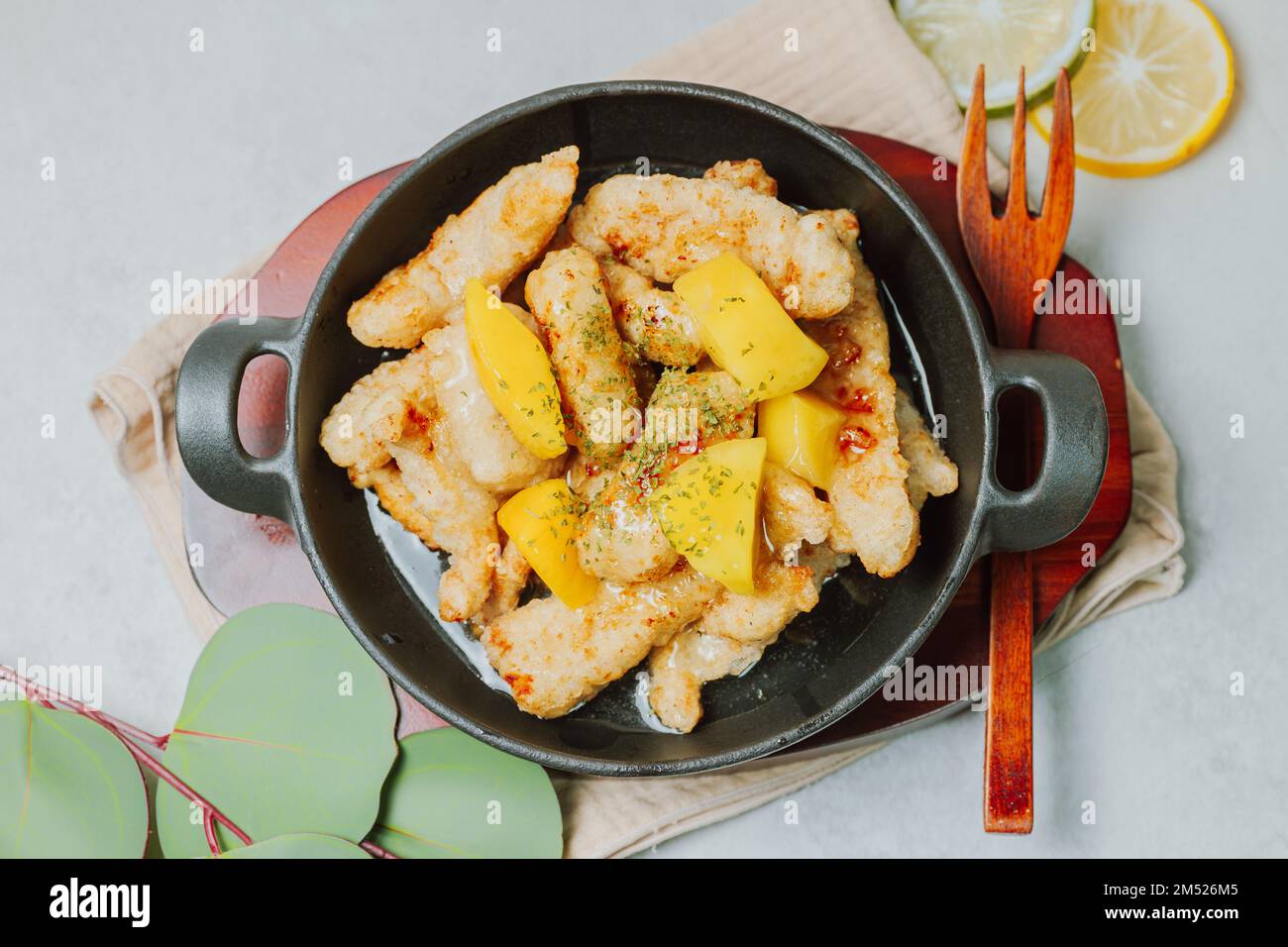 Chinese food sweet and sour pork dish in black bowl Stock Photo - Alamy