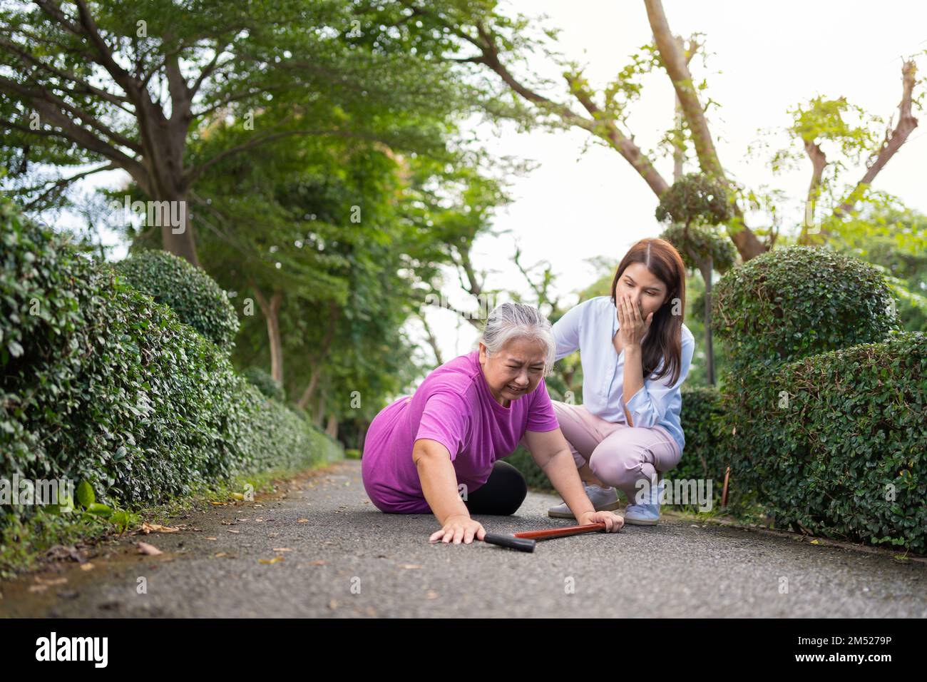 Asian senior woman fell down on lying floor because faint and limb ...