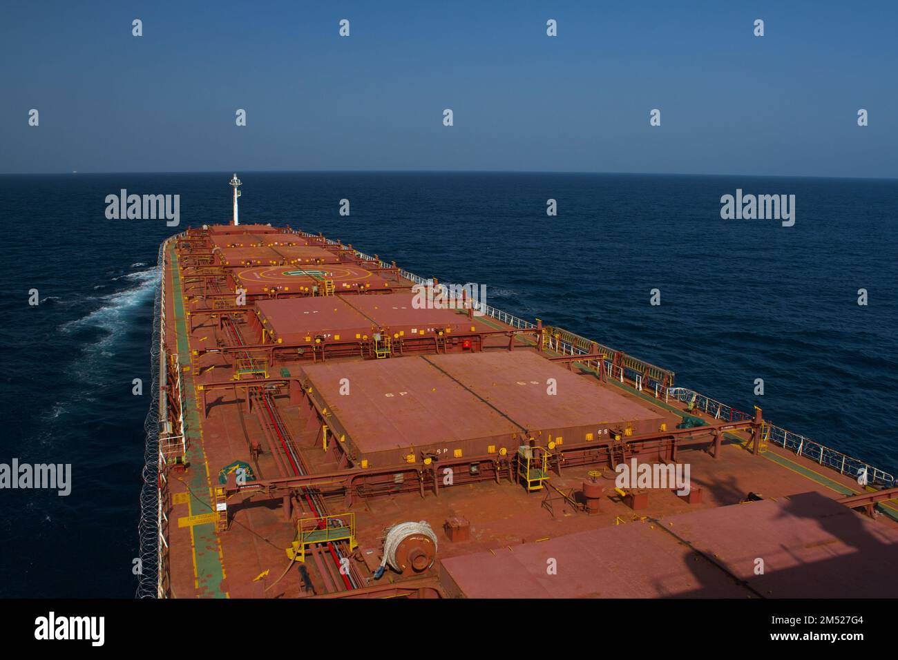 A huge merchant ship carrying bulk cargo on the sea in calm weather ...
