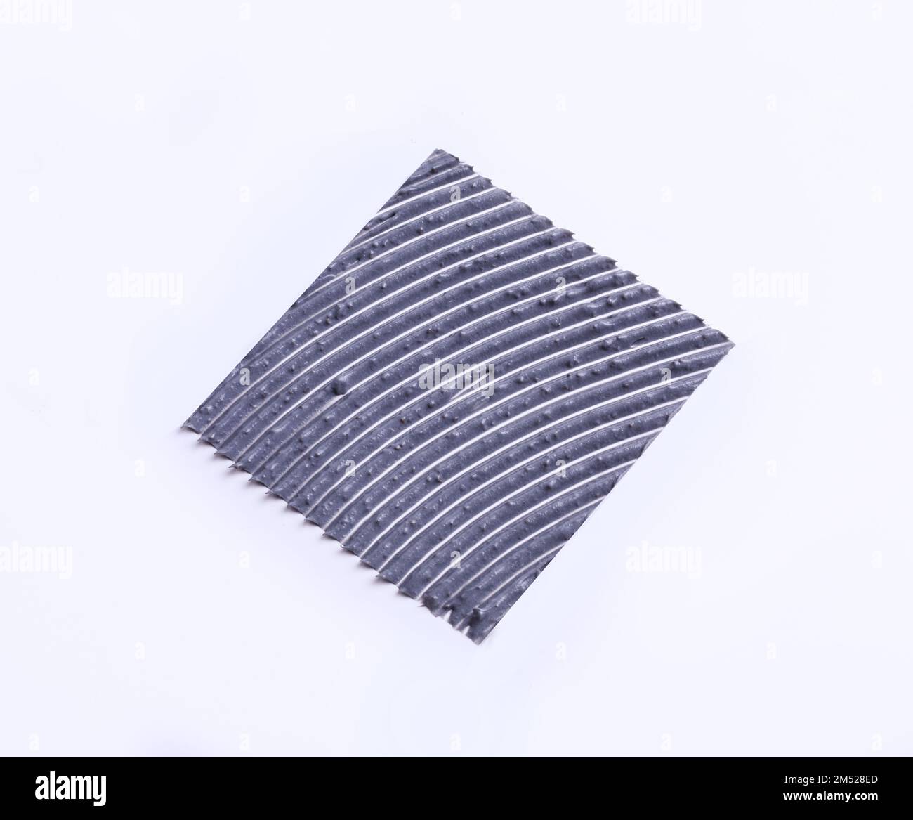 A charcoal clay texture swatch in a square shape with lines on white ...