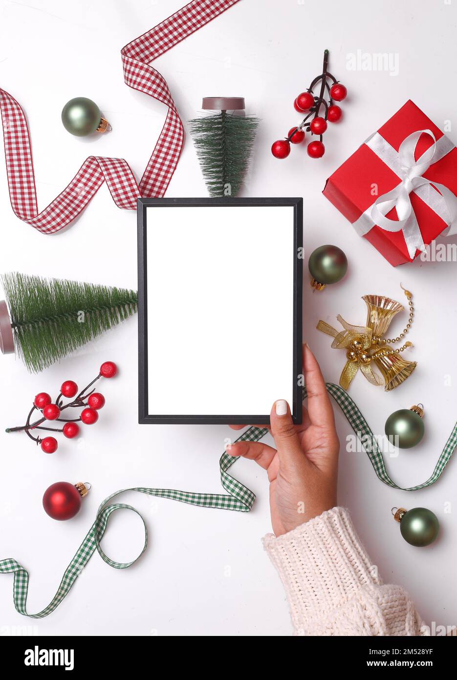 A vertical background design with Christmas decorations around frame ...