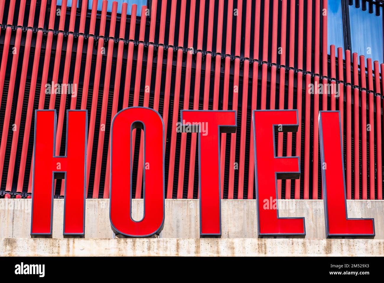 A close-up shot of signage of a hotel with red letters Stock Photo - Alamy