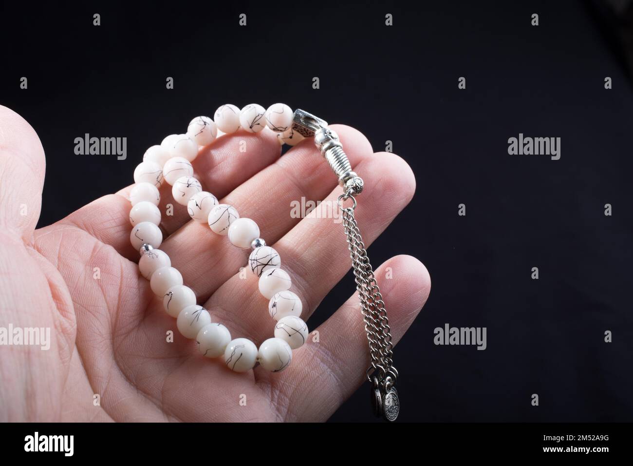Set of some praying beads of various colors in hand Stock Photo - Alamy