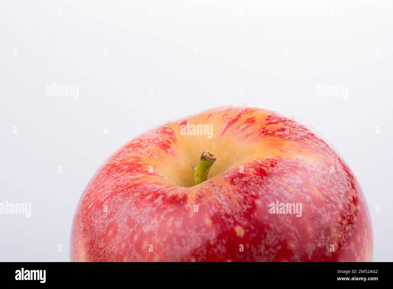 Red apple with dots in close up view Stock Photo - Alamy