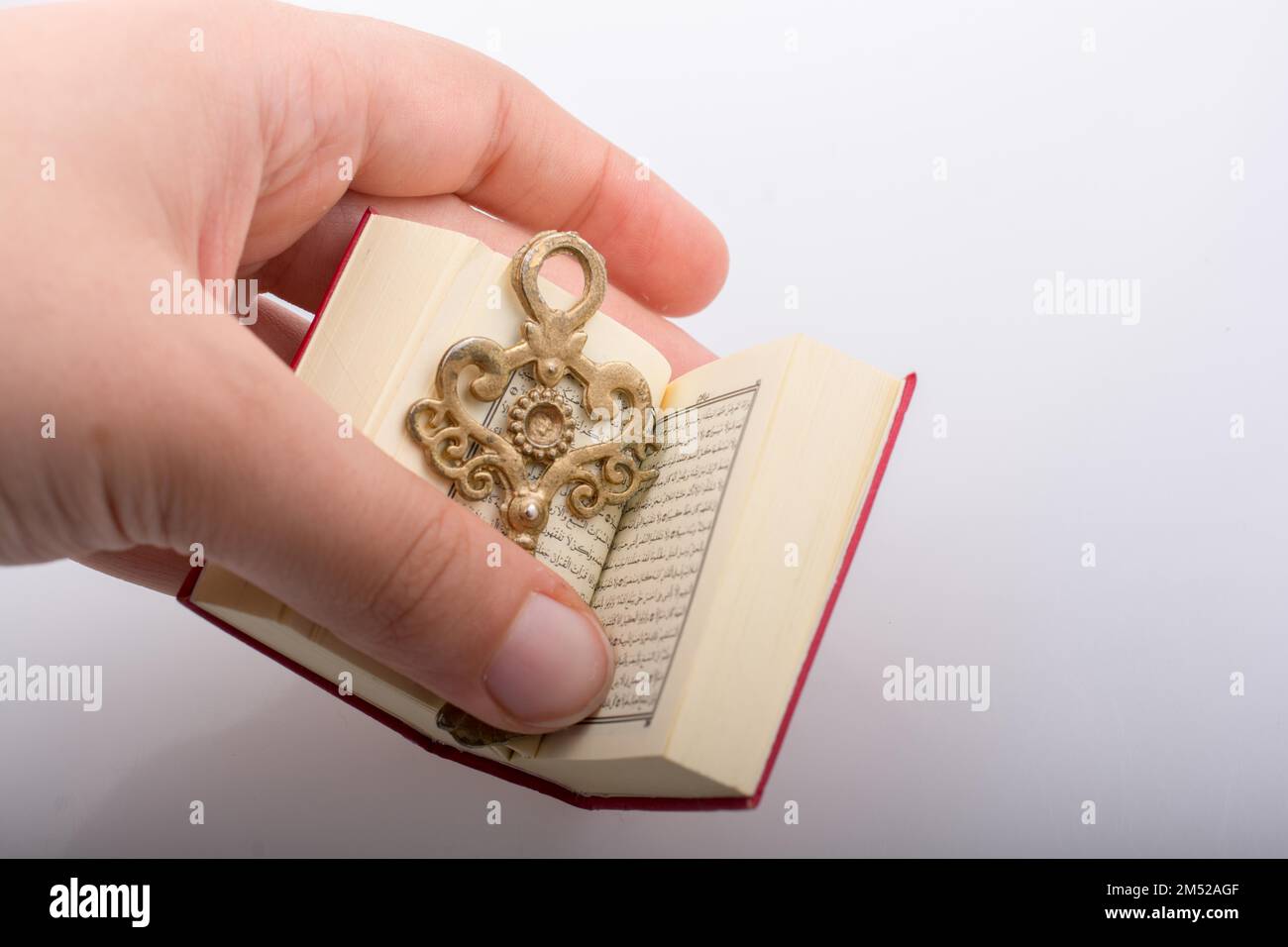 Koran in hand hi-res stock photography and images - Alamy