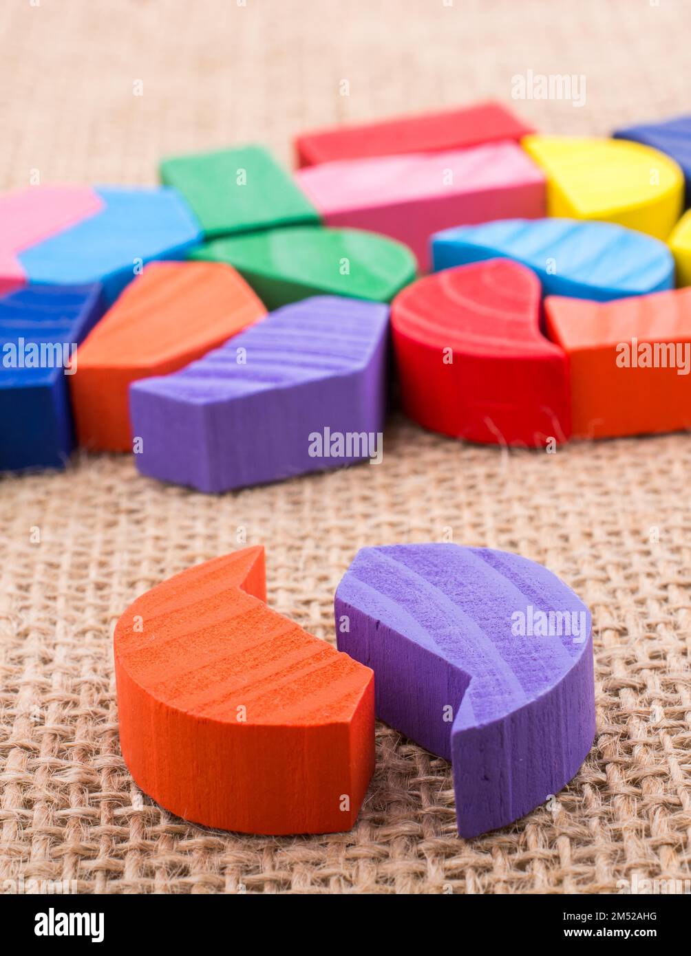 Colorful wooden pieces of a logic puzzle Stock Photo - Alamy