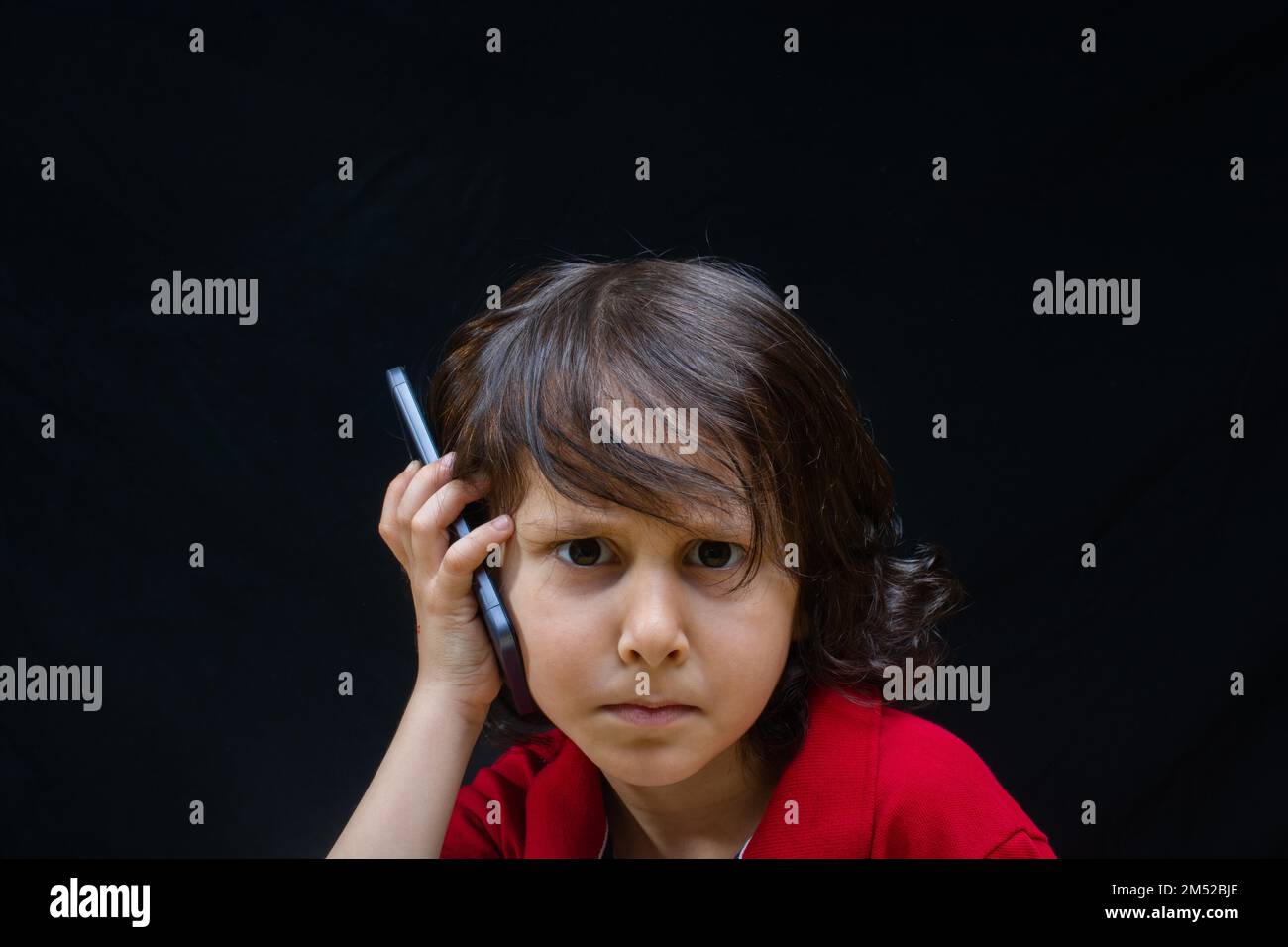 Little boy hold smartphone as modern mobile communication gadget Stock ...