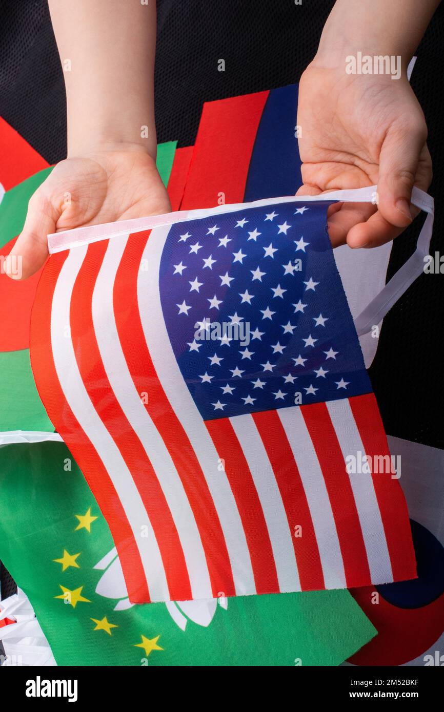 Child hand holding an American national flag in hand Stock Photo - Alamy
