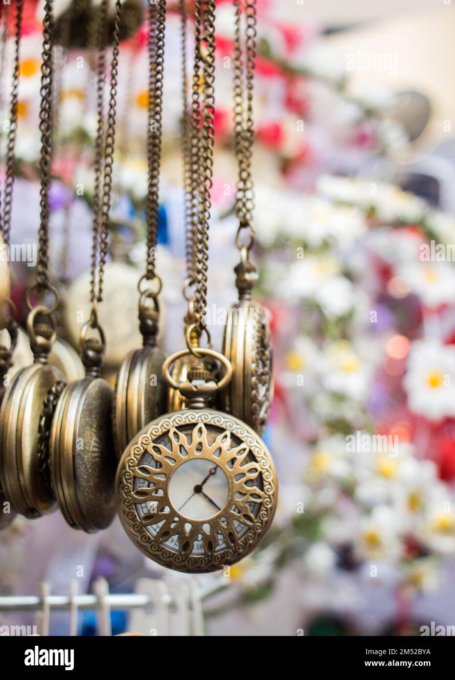 Set of retro styled pocket watches hanging Stock Photo - Alamy