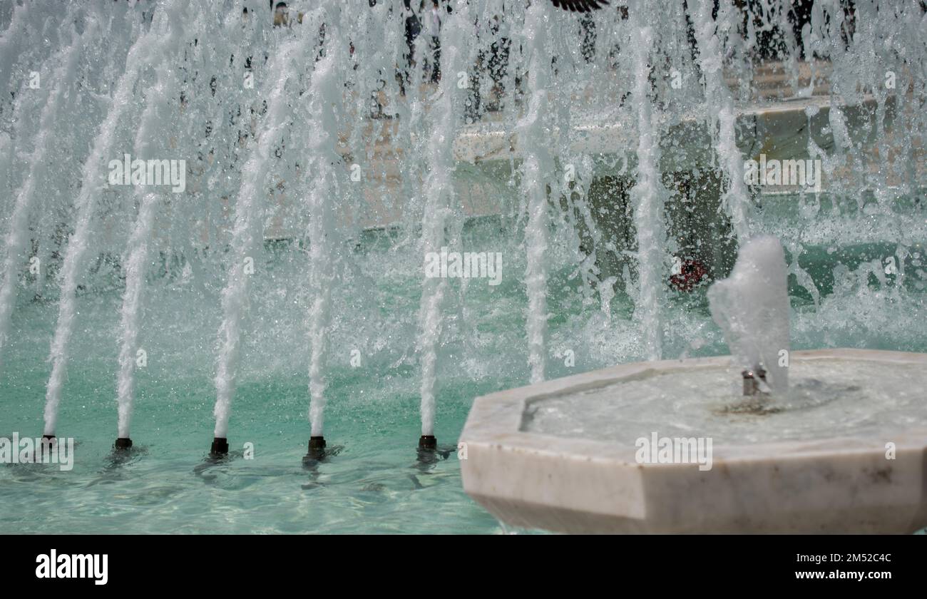 The fountains gushing sparkling water in a pool in a park Stock Photo ...