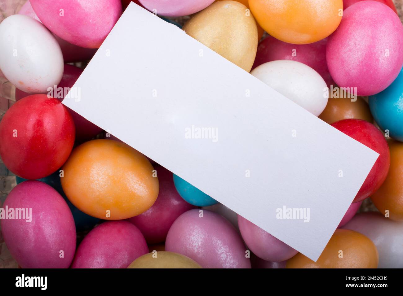 Small piece of empty paper on colorful decorative candies Stock Photo ...