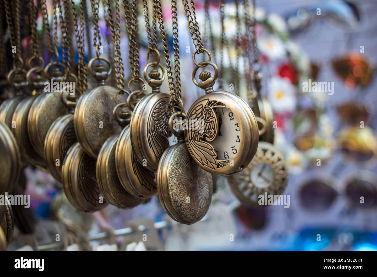 Set of retro styled pocket watches hanging Stock Photo - Alamy