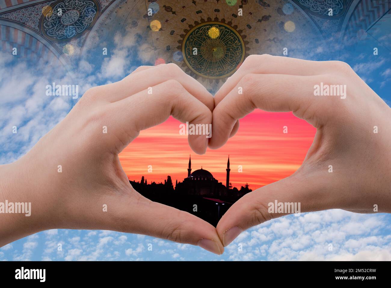 Islamic mosque view seen behind a heart shaped hand Stock Photo - Alamy