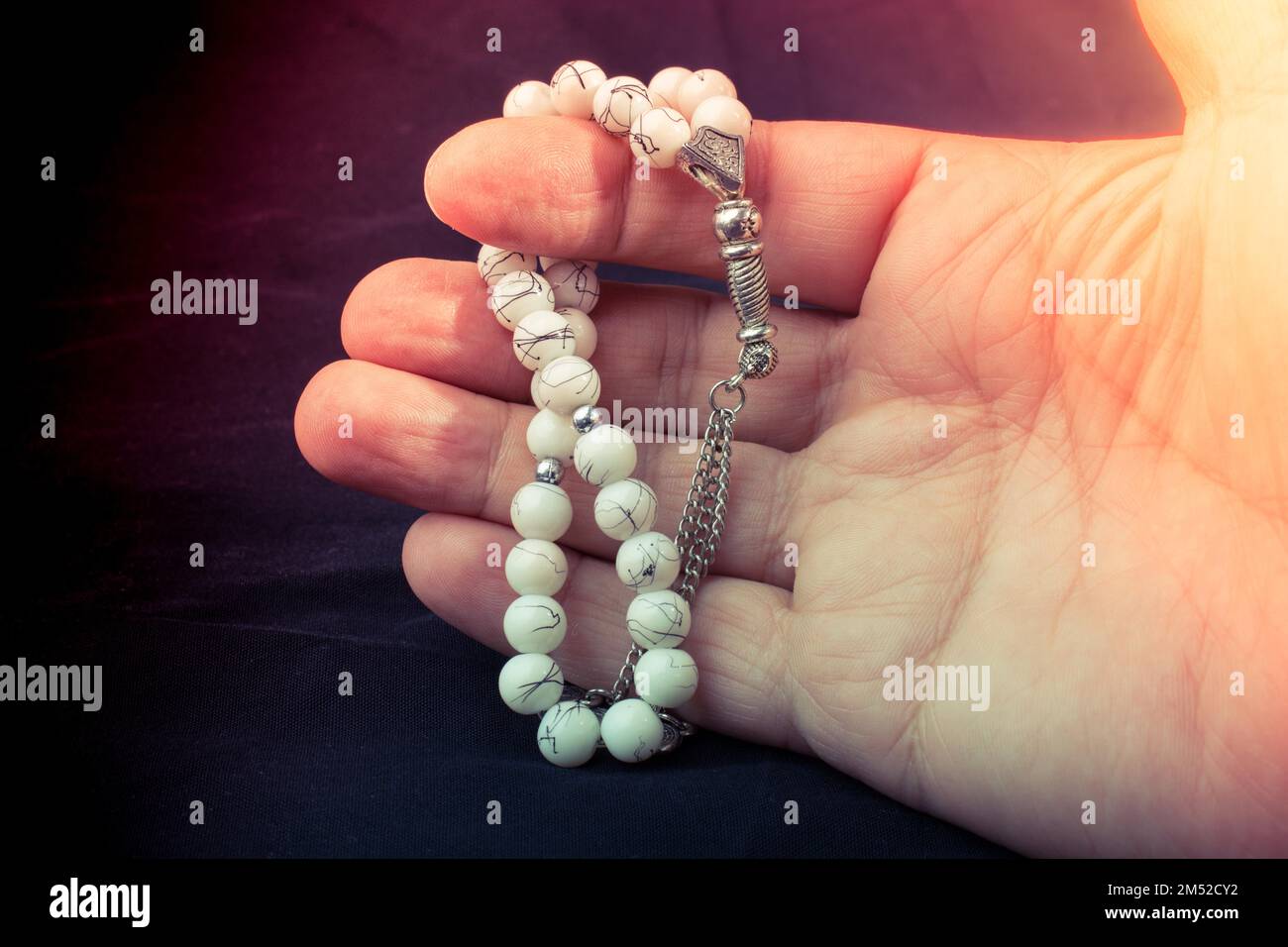 Set of some praying beads of various colors in hand Stock Photo - Alamy