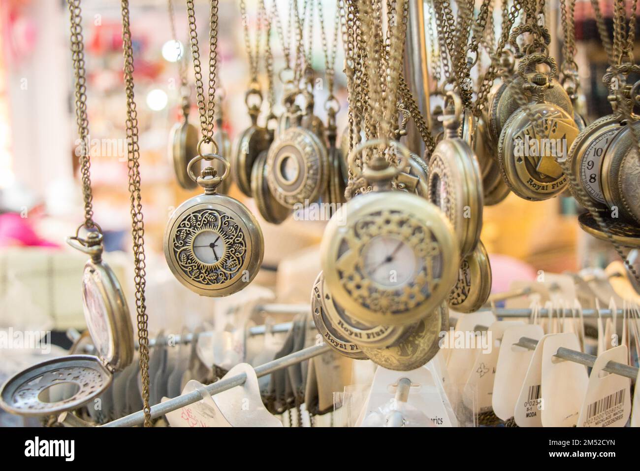 Set of retro styled pocket watches hanging Stock Photo - Alamy