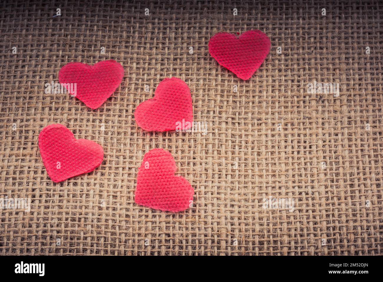 Heart shaped objects on a linen canvas Stock Photo - Alamy