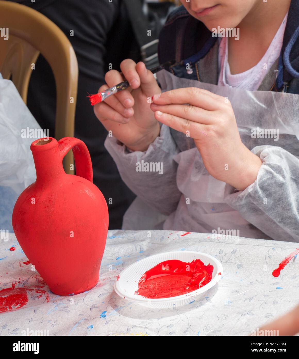 Young children decorating their handmade clay pottery Stock Photo - Alamy