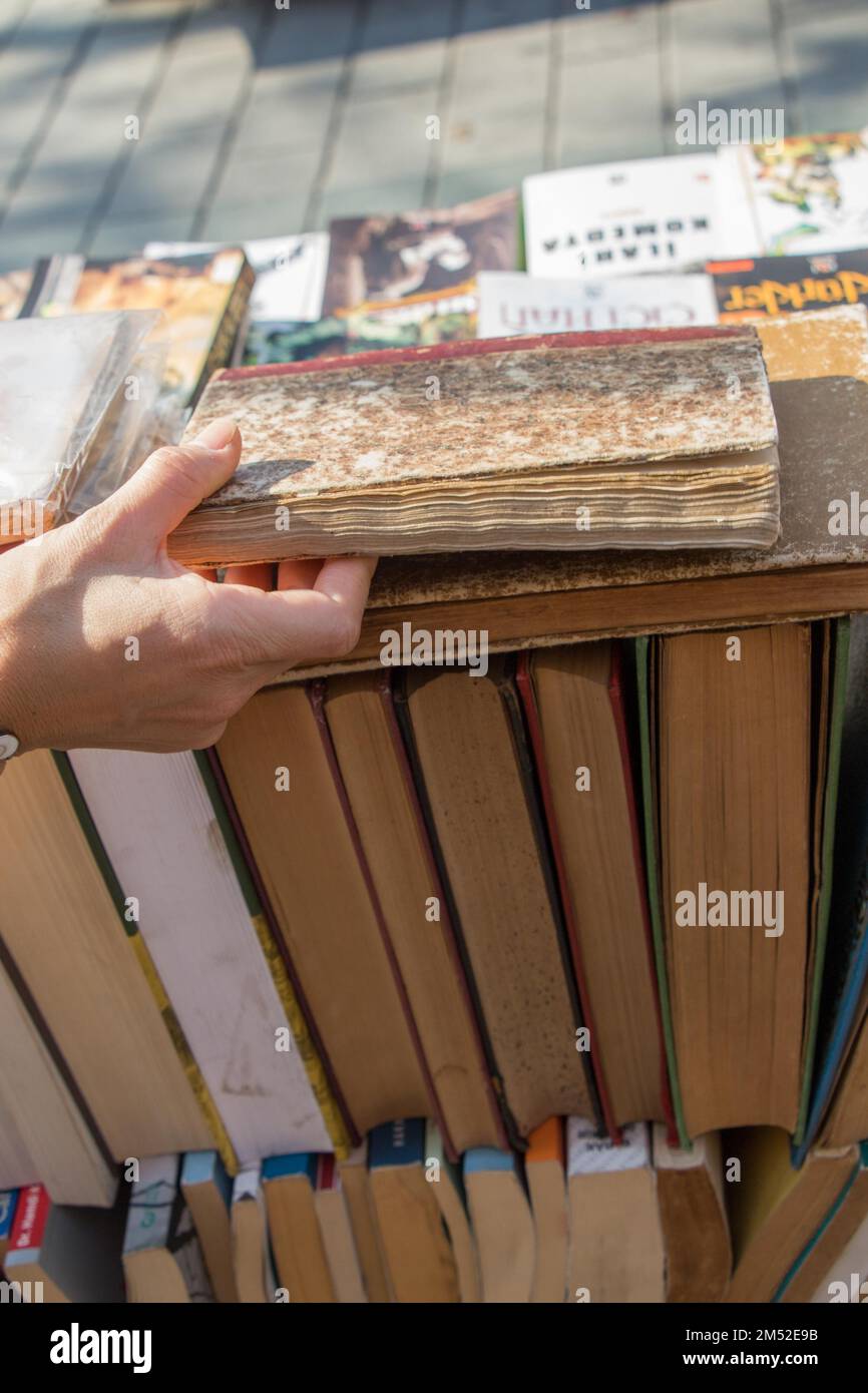 Book pages partly in view on white background Stock Photo - Alamy