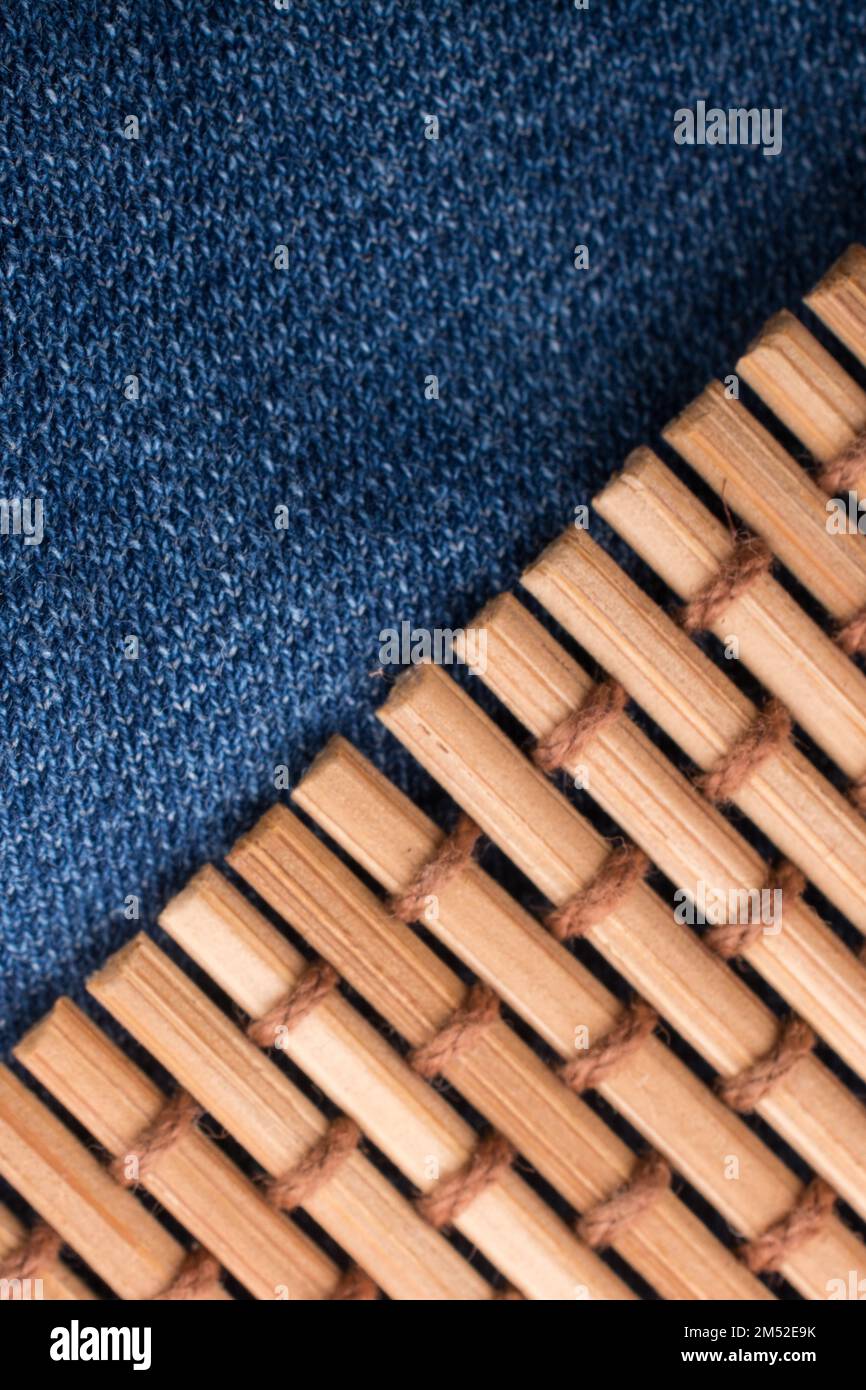 Straw mat placed on denim canvas as a background Stock Photo - Alamy