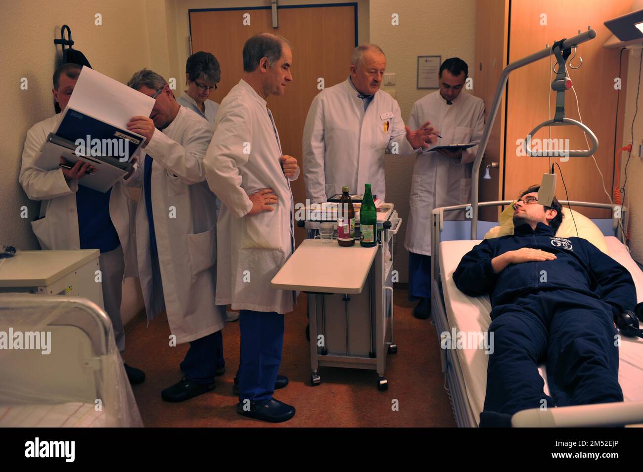 Regular hospital rounds, such as this visit by the head physician of ...