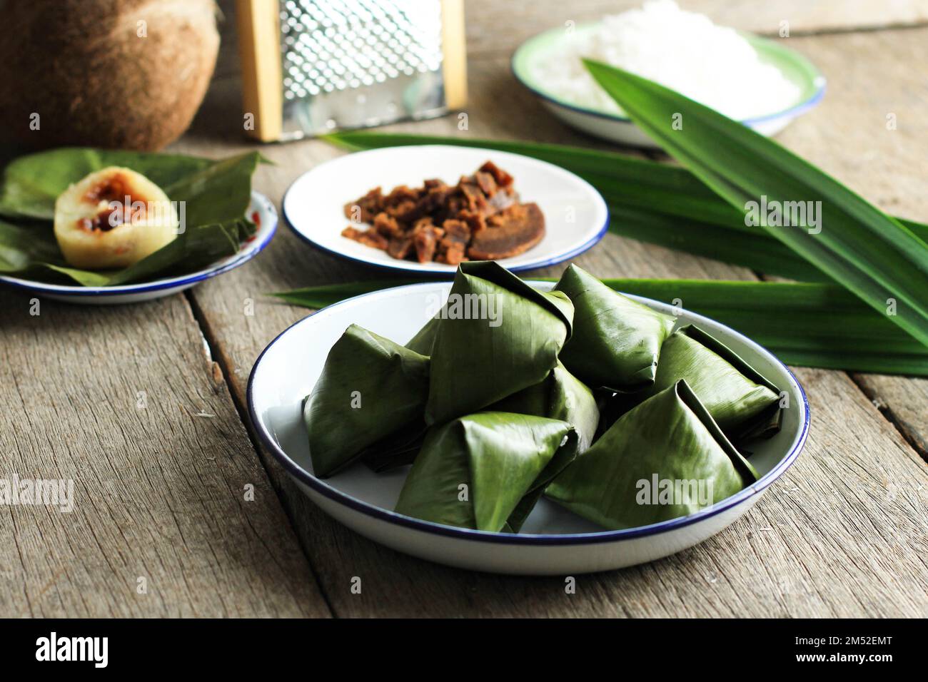 Sweet Stuffed Dough Pyramid Dumpling or Kanom Tian or Khanom Tien. Wrapped with Banana Leaf ...
