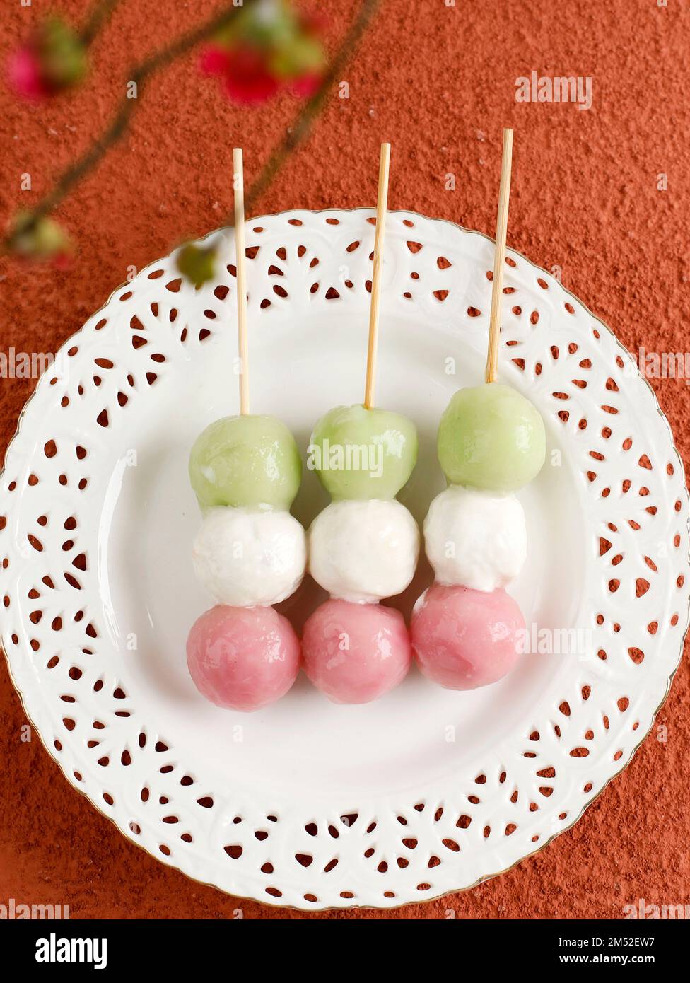 Skewered Sanshoku Dango on White Plate. View from Above Stock Photo - Alamy