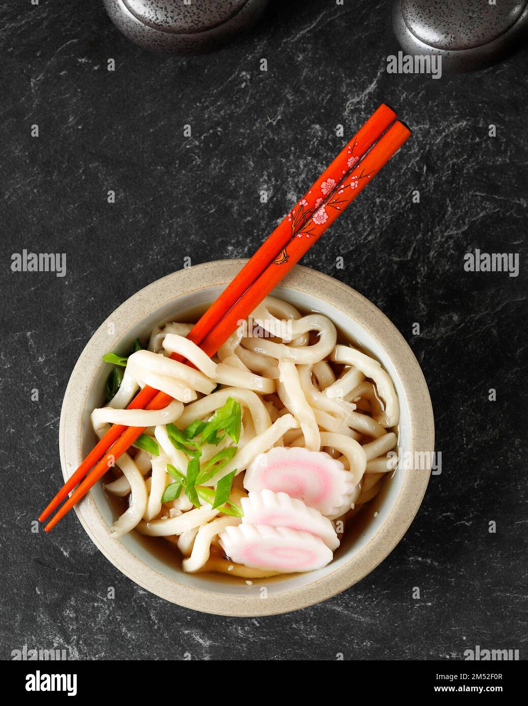 Top View Japanese Kake Udon with Kamaboko Topping. On Black Cement ...