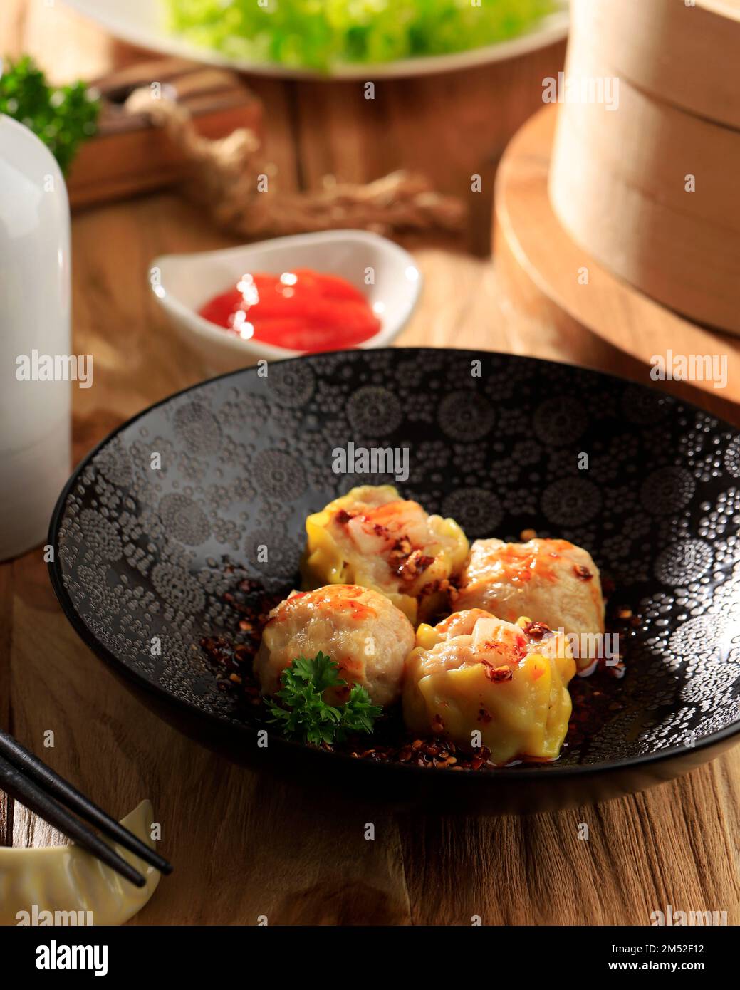 Chinese Mini Dimsum with Chilli Oil Dressing Stock Photo - Alamy