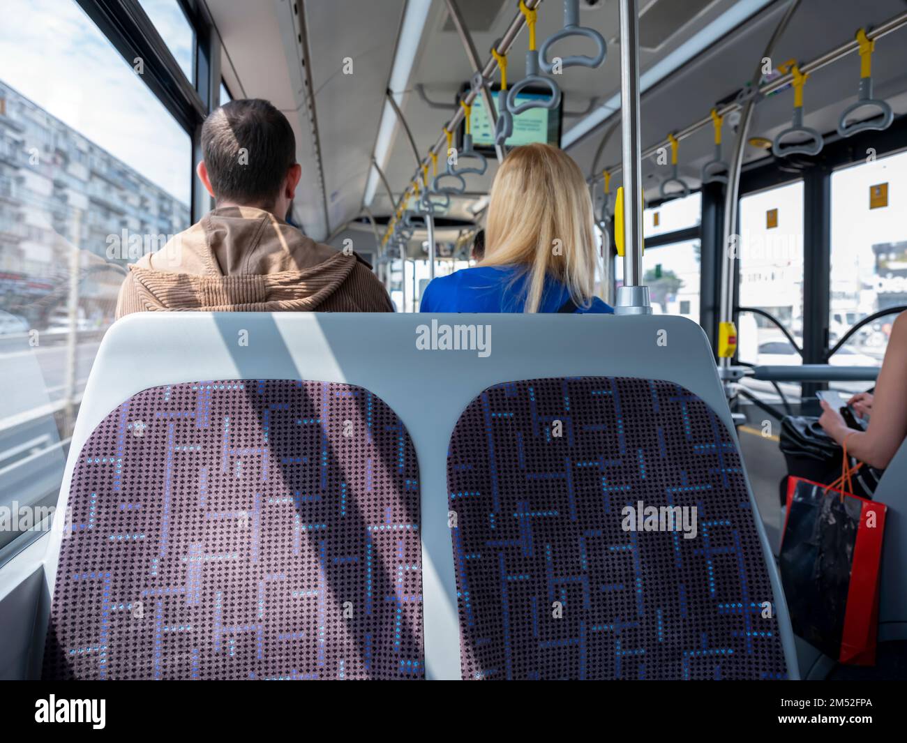 A back view of passengers and empty seats inside a public bus Stock ...