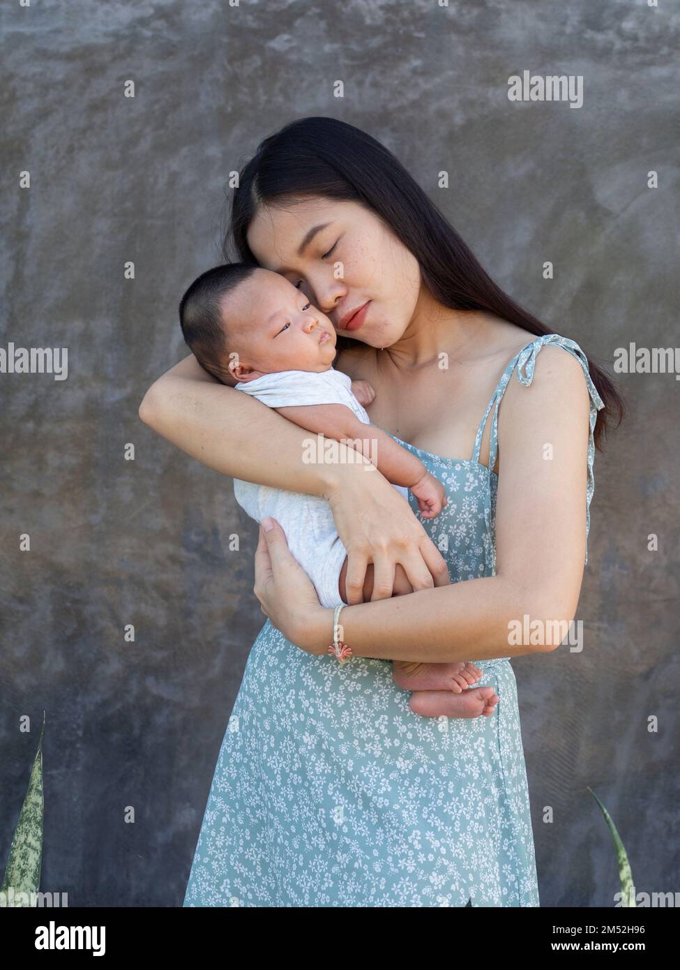 Woman and baby Asian and nationality Thai is happy feel Stock Photo - Alamy