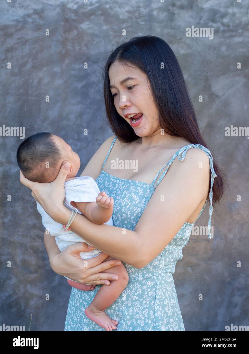 Woman and baby Asian and nationality Thai is happy feel Stock Photo - Alamy